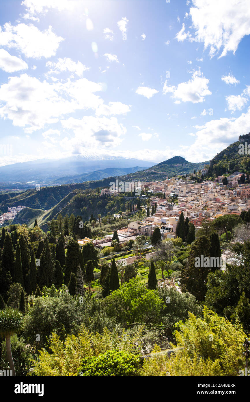 Etna volcano and Taormina town aerial panoramic view. Roofs of a lot of ...