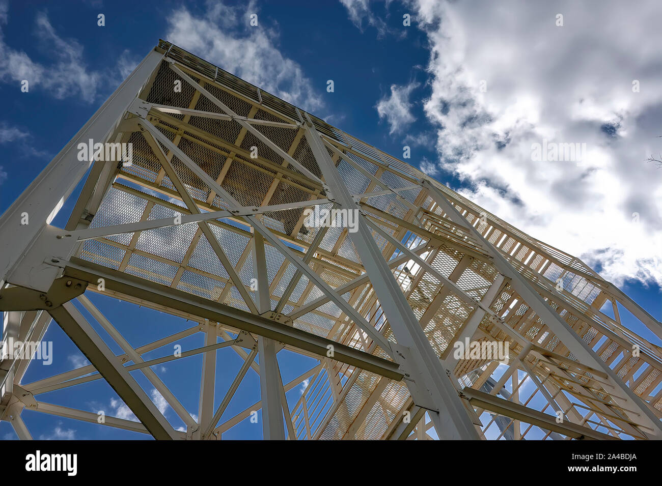 Industrial construction. Metal structures against the blue sky and ...