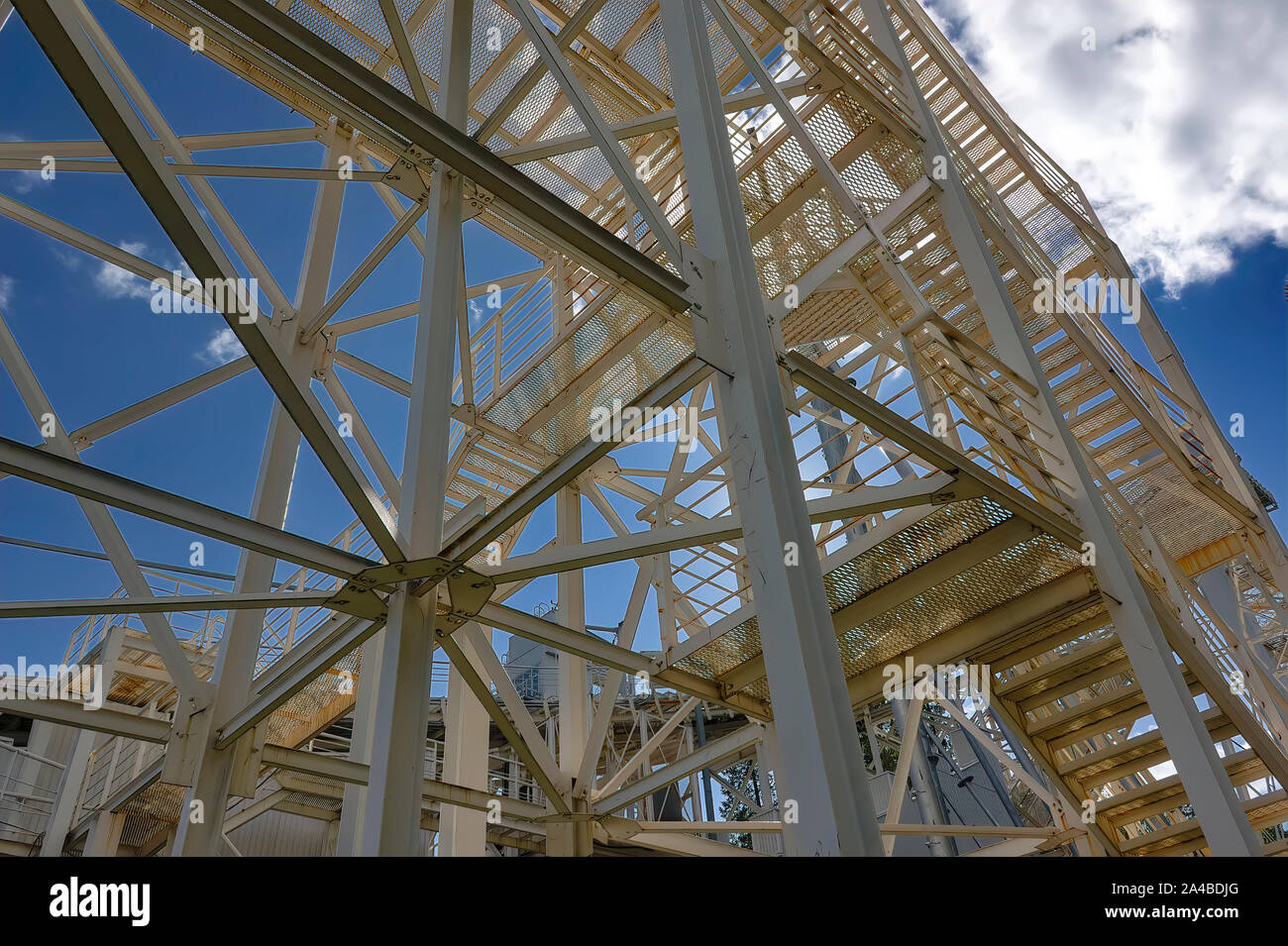 Industrial construction. Metal structures against the blue sky and ...