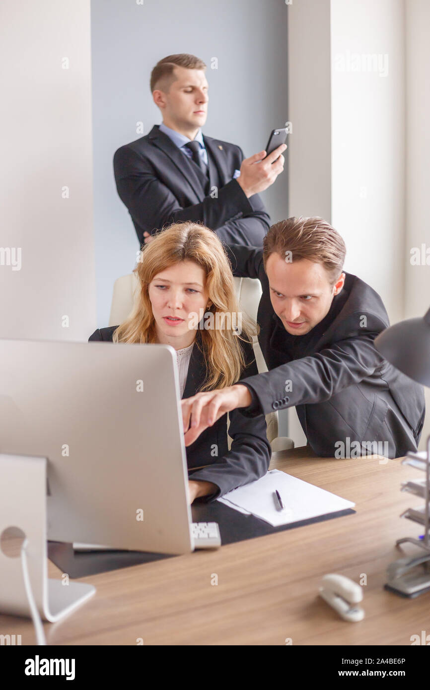 Office workers at computer in modern office Stock Photo - Alamy