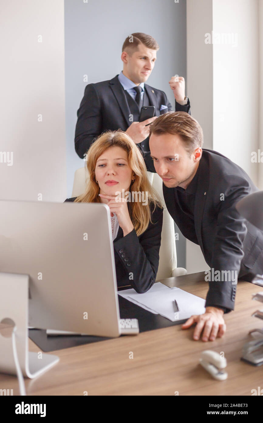 Office workers at computer in modern office Stock Photo - Alamy