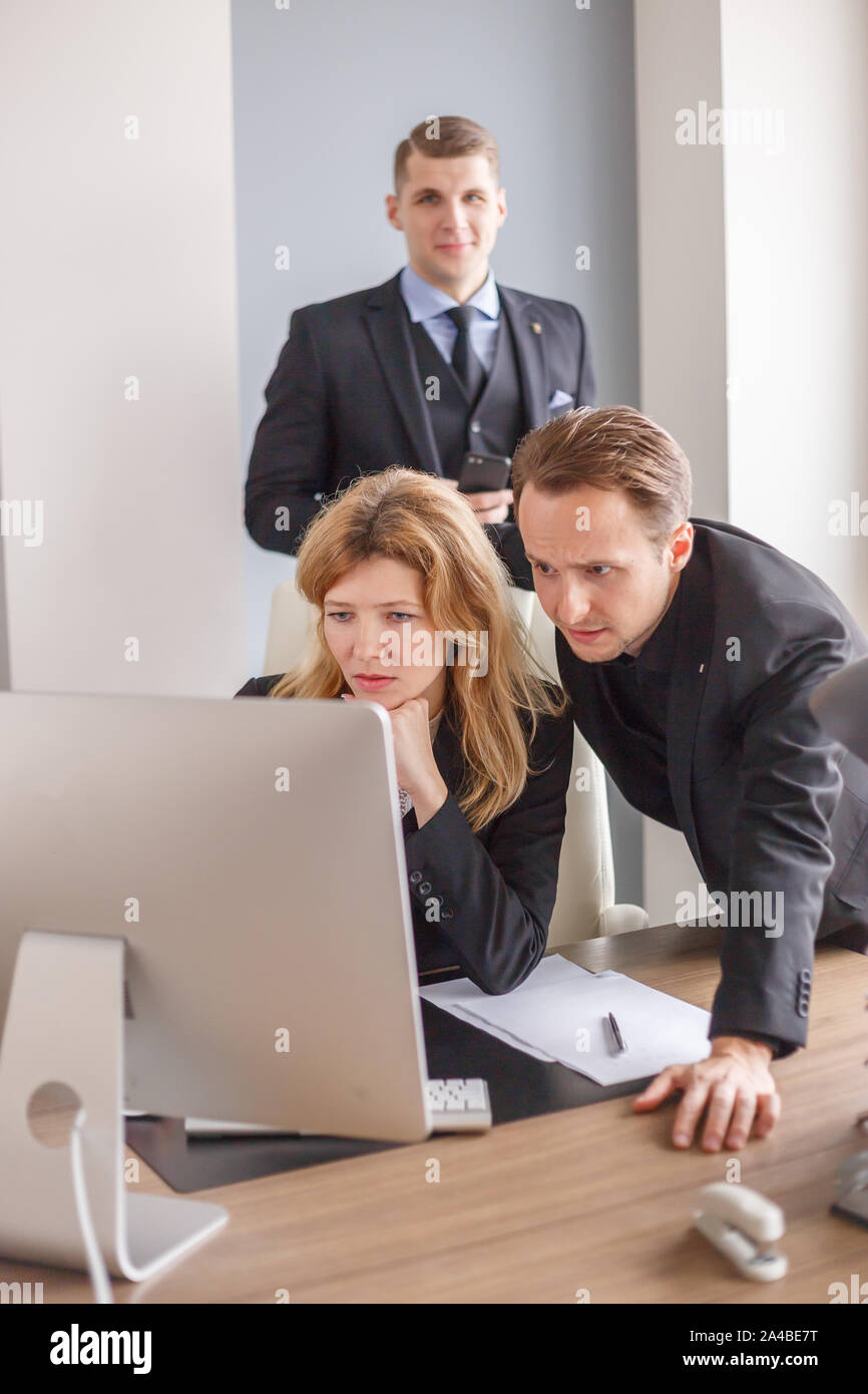 Office workers at computer in modern office Stock Photo - Alamy