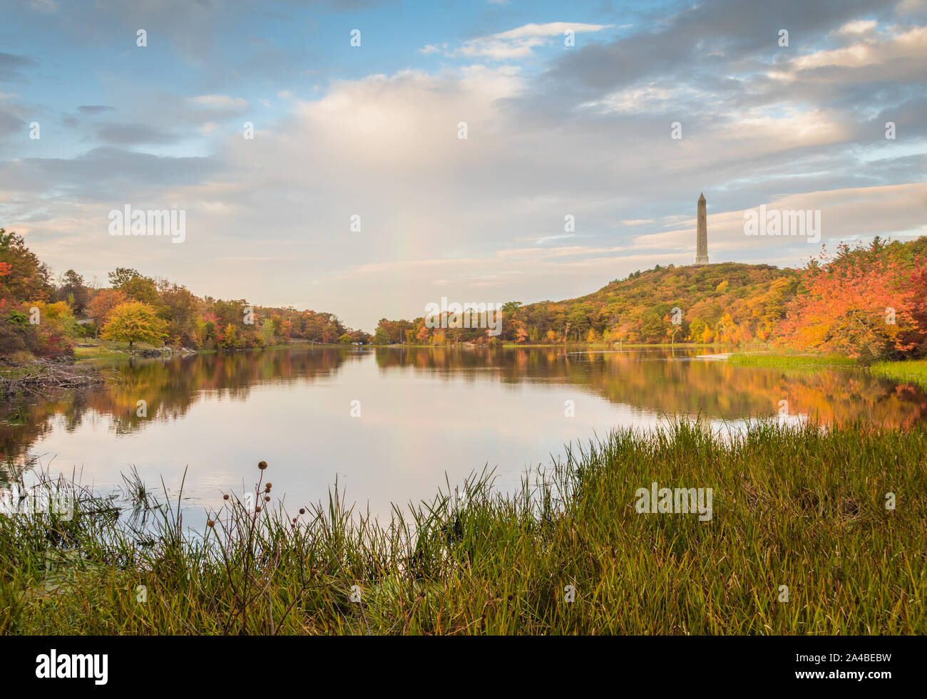 Fall foliage surrounds Lake Marcia as High Point Veteran's Monument ...