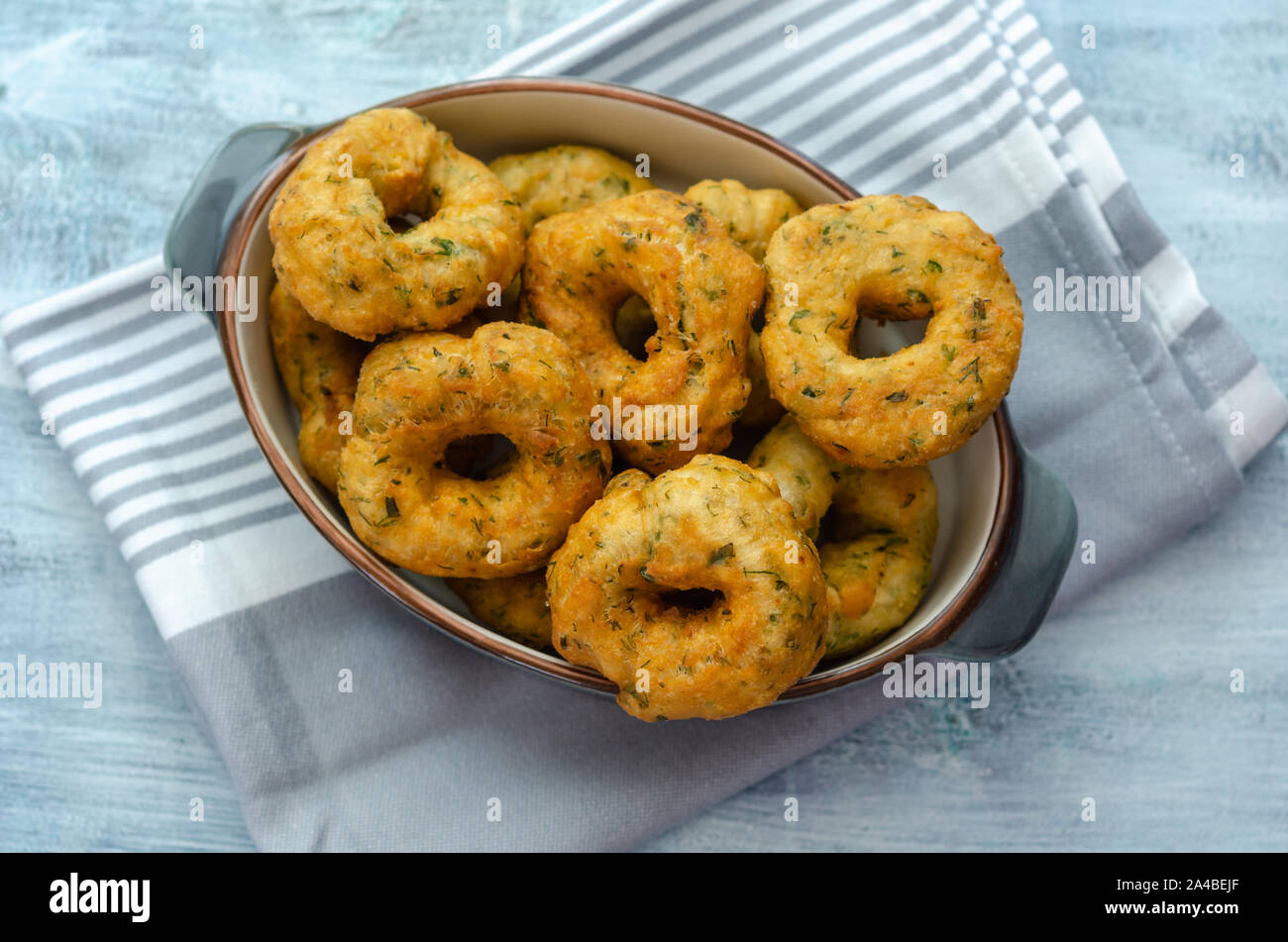 Traditional Turkish pastry : Pişi ; fried dough in oil with dill in ...