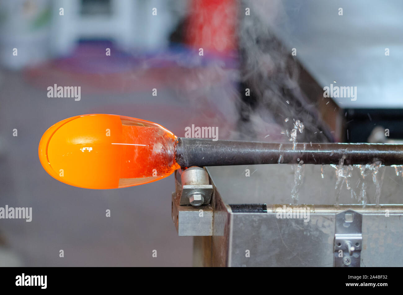 Glass blower manufacturing process, moment of cooling the glass at a ...