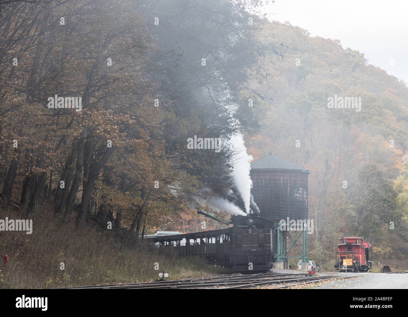 The Cass Scenic Railroad's Shay Locomotive #5 pulls past a water tower ...