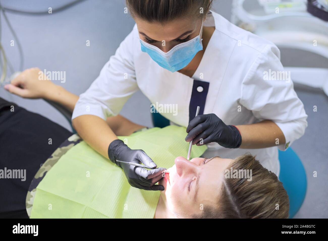 Dental treatment at the dental clinic, female doctor treating patient ...
