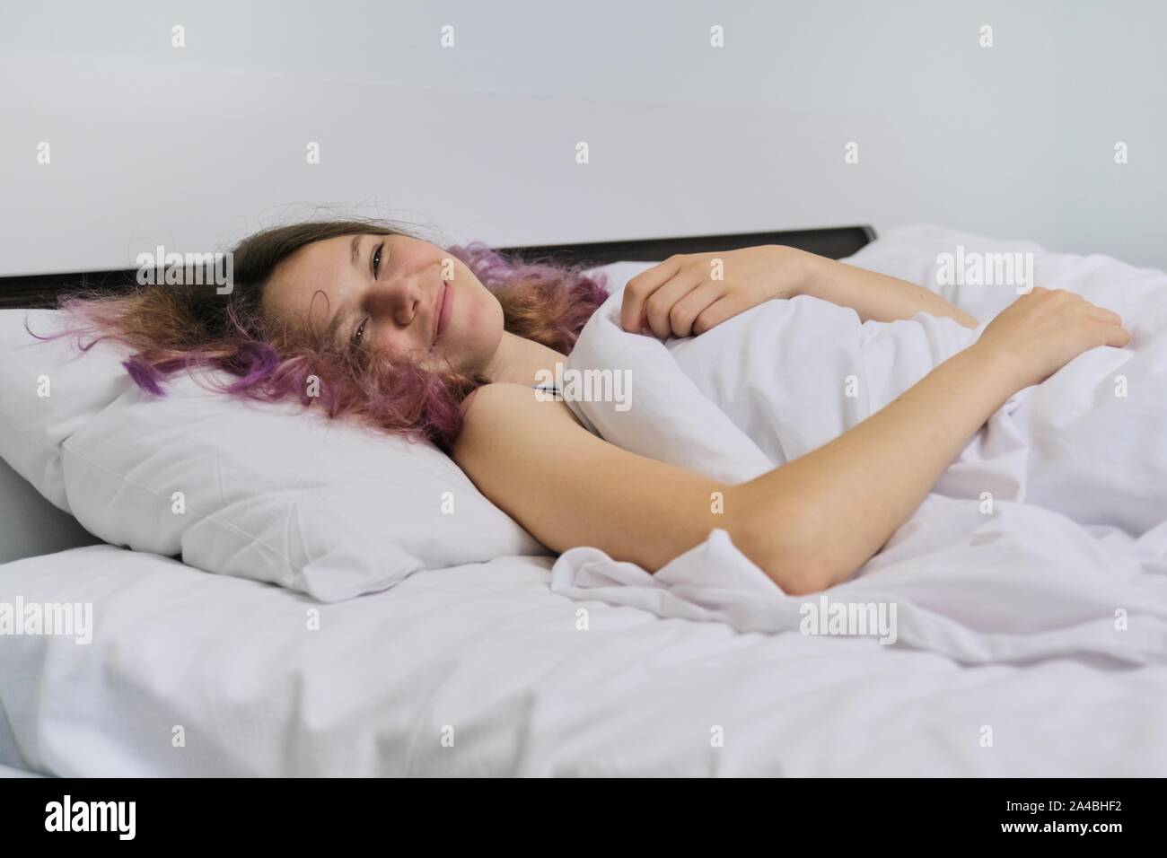 Girl waking up bed teen hi-res stock photography and images - Alamy