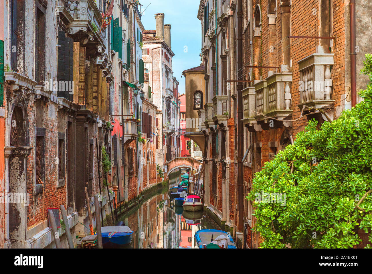 Beautiful view of Venice canal with traditional boats and colorful ...