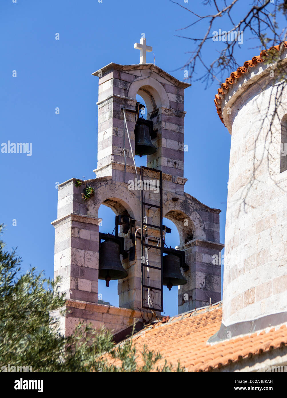 View of the Holy Trinity church bell tower from the narrow streets of ...