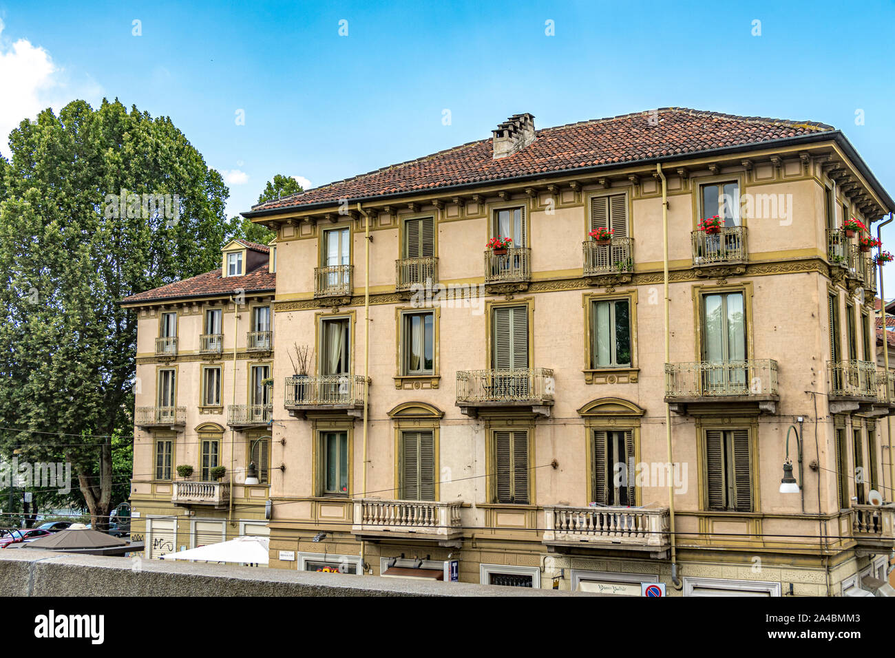 Apartment block with wooden shutters and stone balconies at Piazza Gran ...
