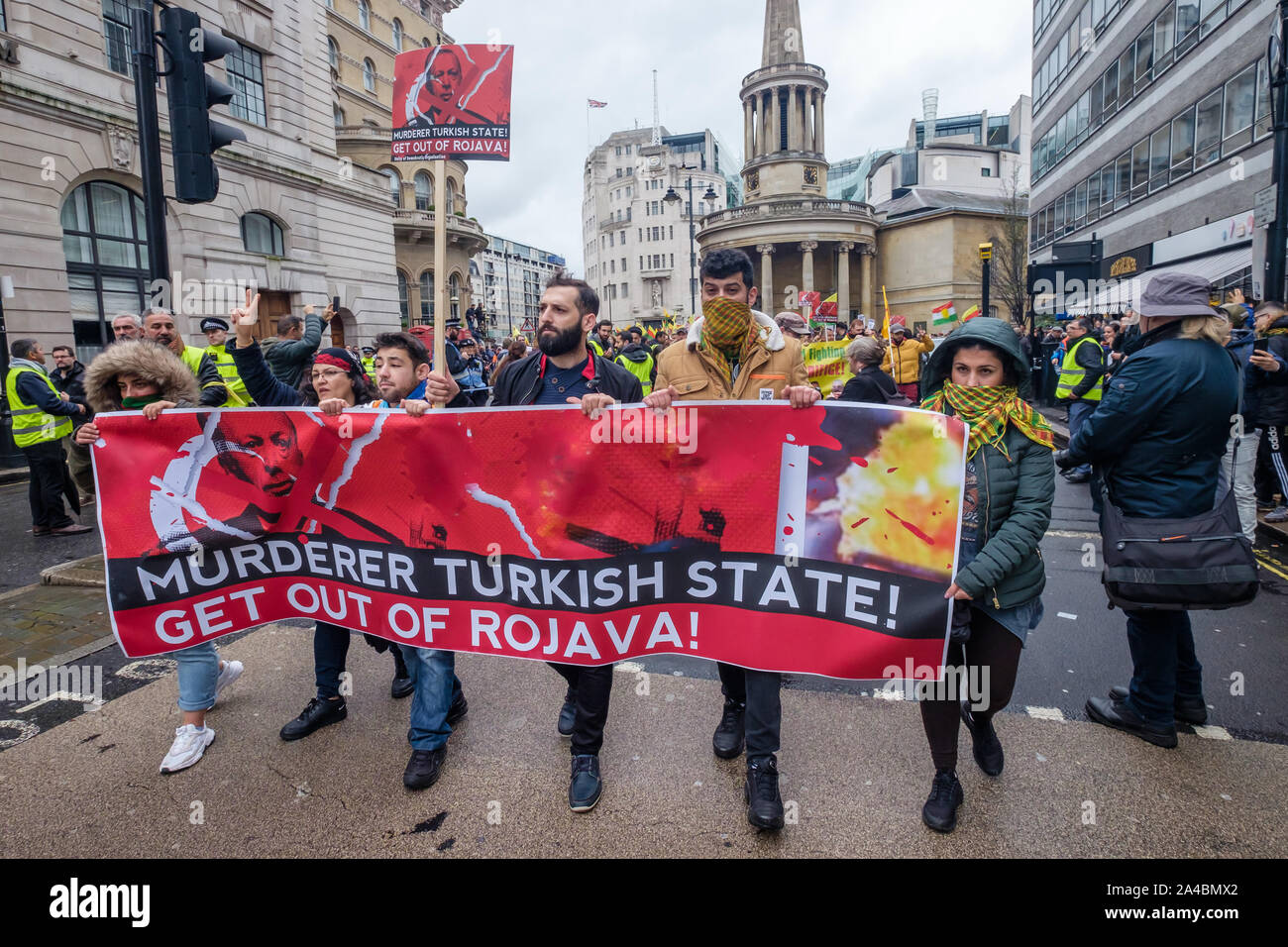 London, UK. 13th October 2019. A banner on the march 'Murderer Turkish ...