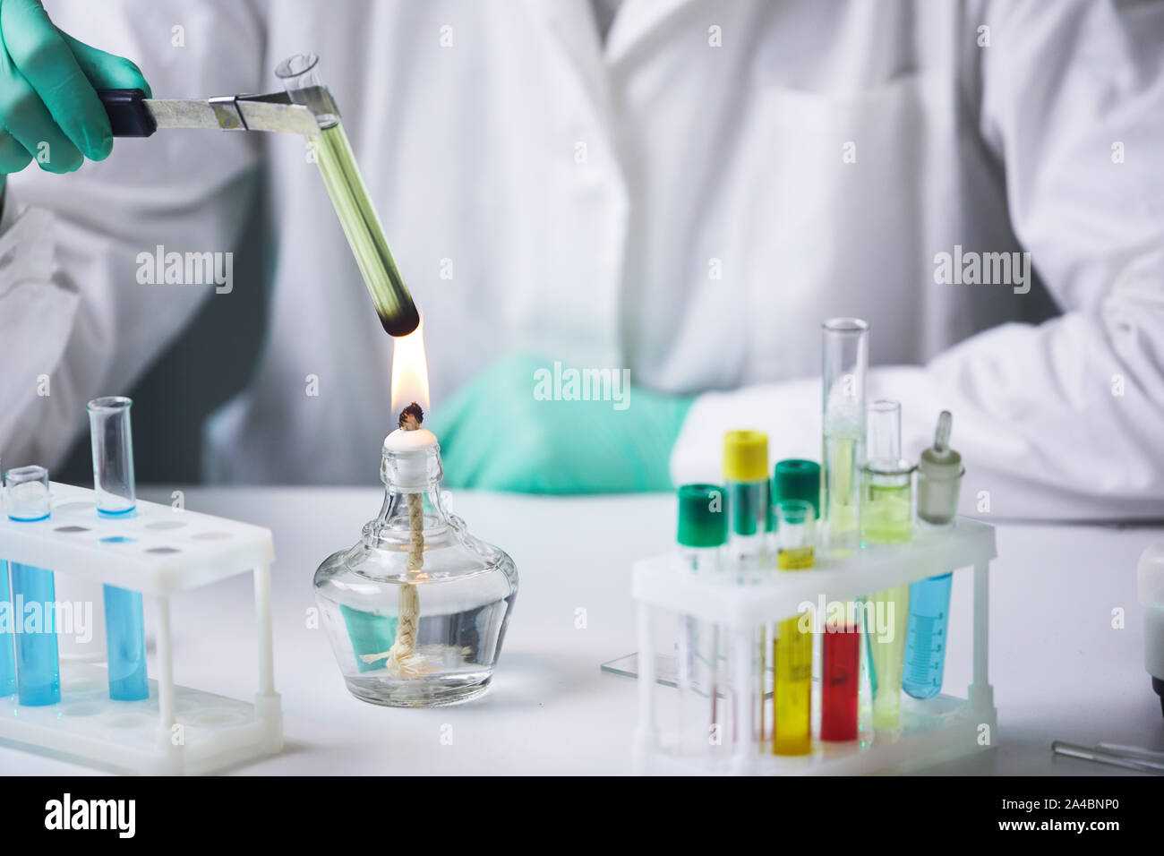 Technician holding and examining test tubes hi-res stock photography ...