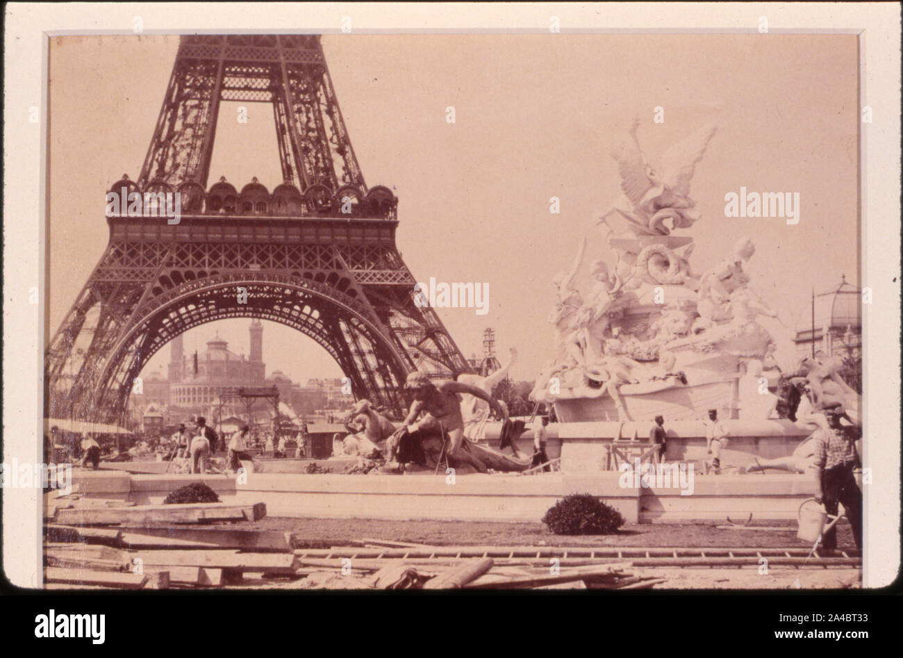 Men building the Fountain St. Vidal near the Eiffel Tower, Paris ...