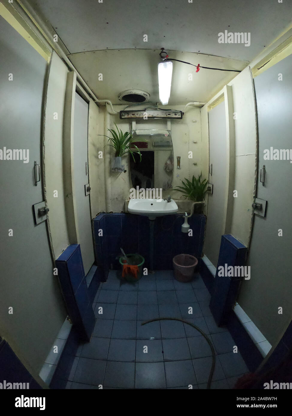 Entrance hallway with sink and door to a public toilet on a ship ferry ...