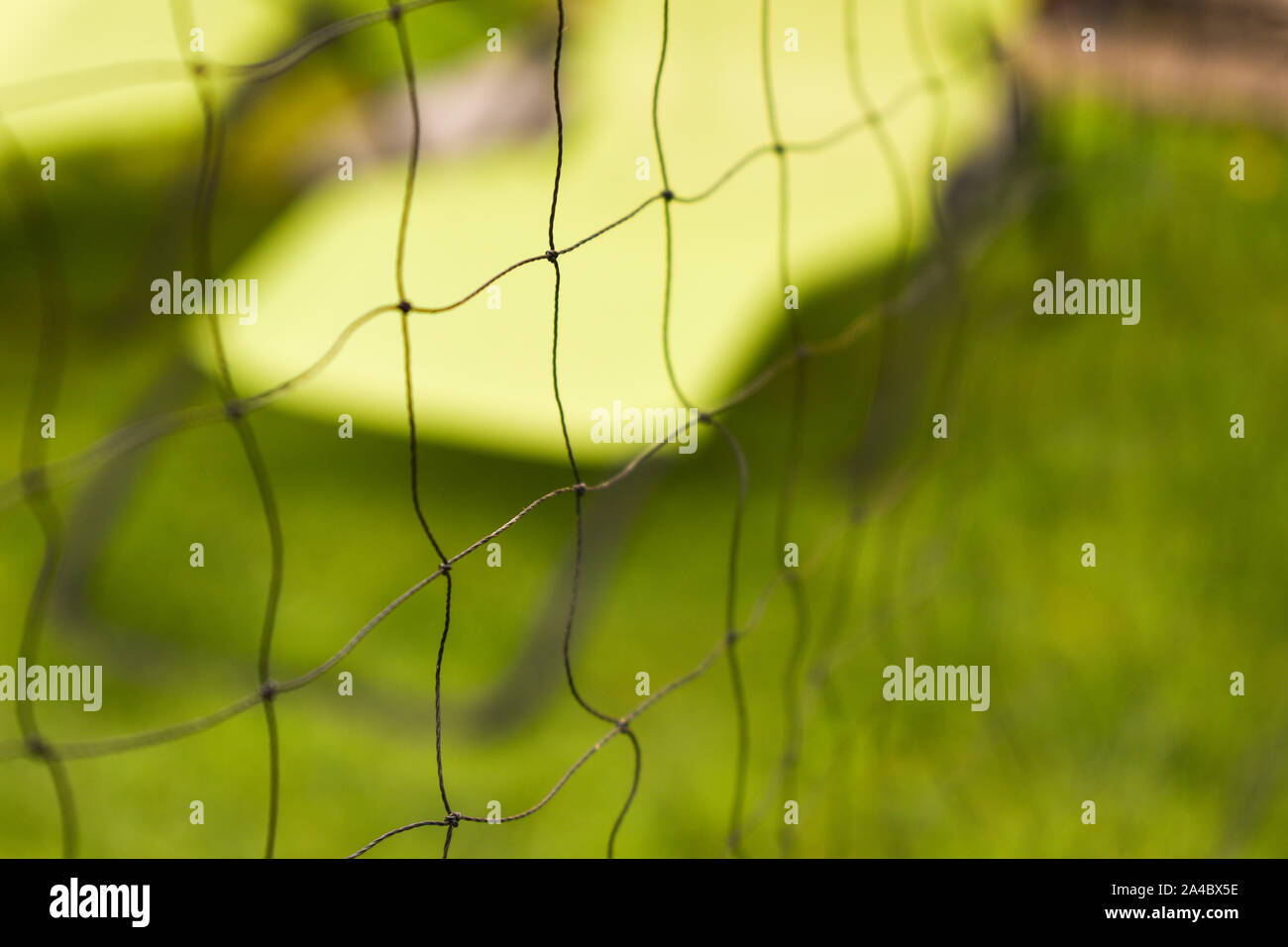 Abstract badminton net pattern with green background. Blurry abstract ...