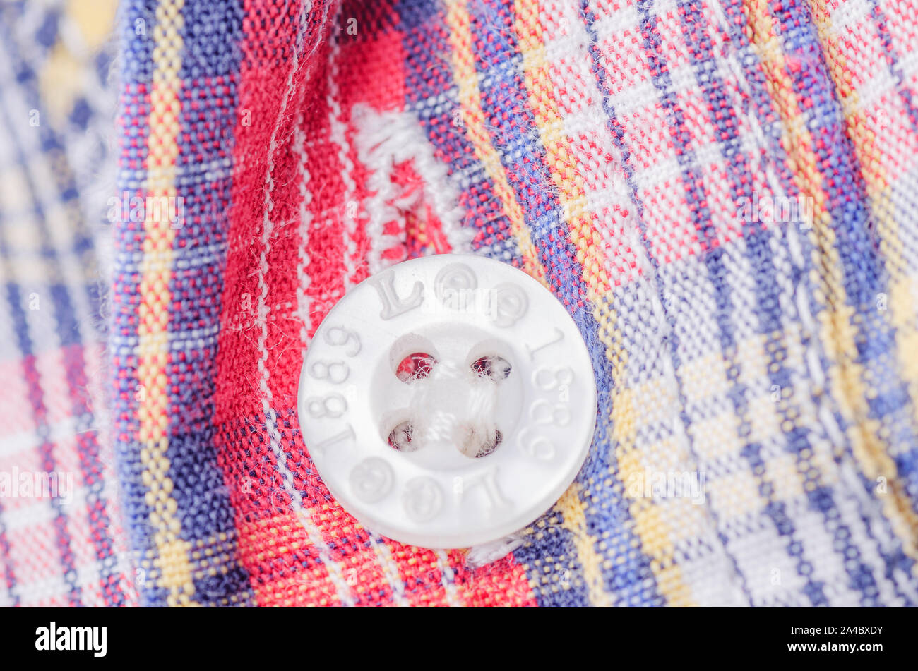 Closeup of Lee button on clothes Stock Photo - Alamy