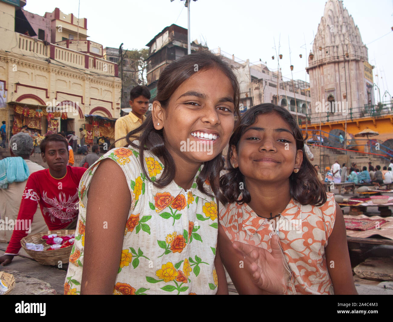 Two Indian girls at the riverbank of the Ganges, in the Hindu ...