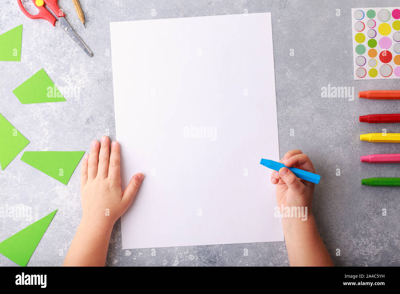 Child draws a pencil drawing empty space colorful grey background top ...
