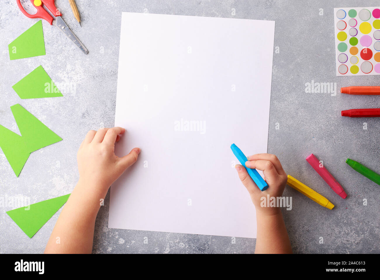 Child draws a pencil drawing empty space colorful grey background top ...