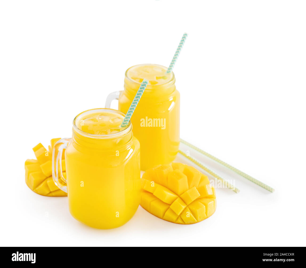 Fresh tropical mango juice with beautiful diced pulp and striped paper ...