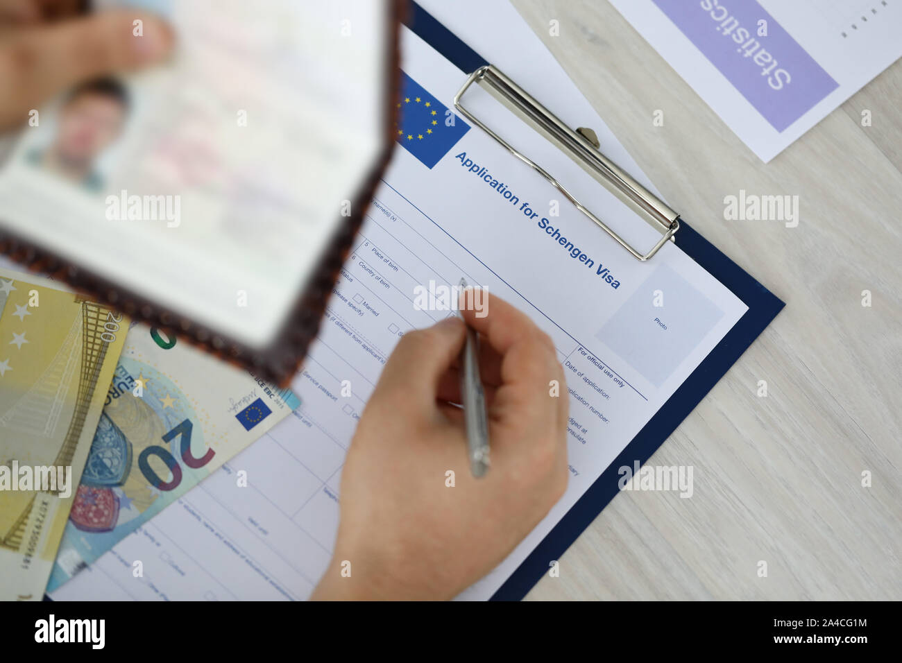 Man drawing up forms Stock Photo - Alamy