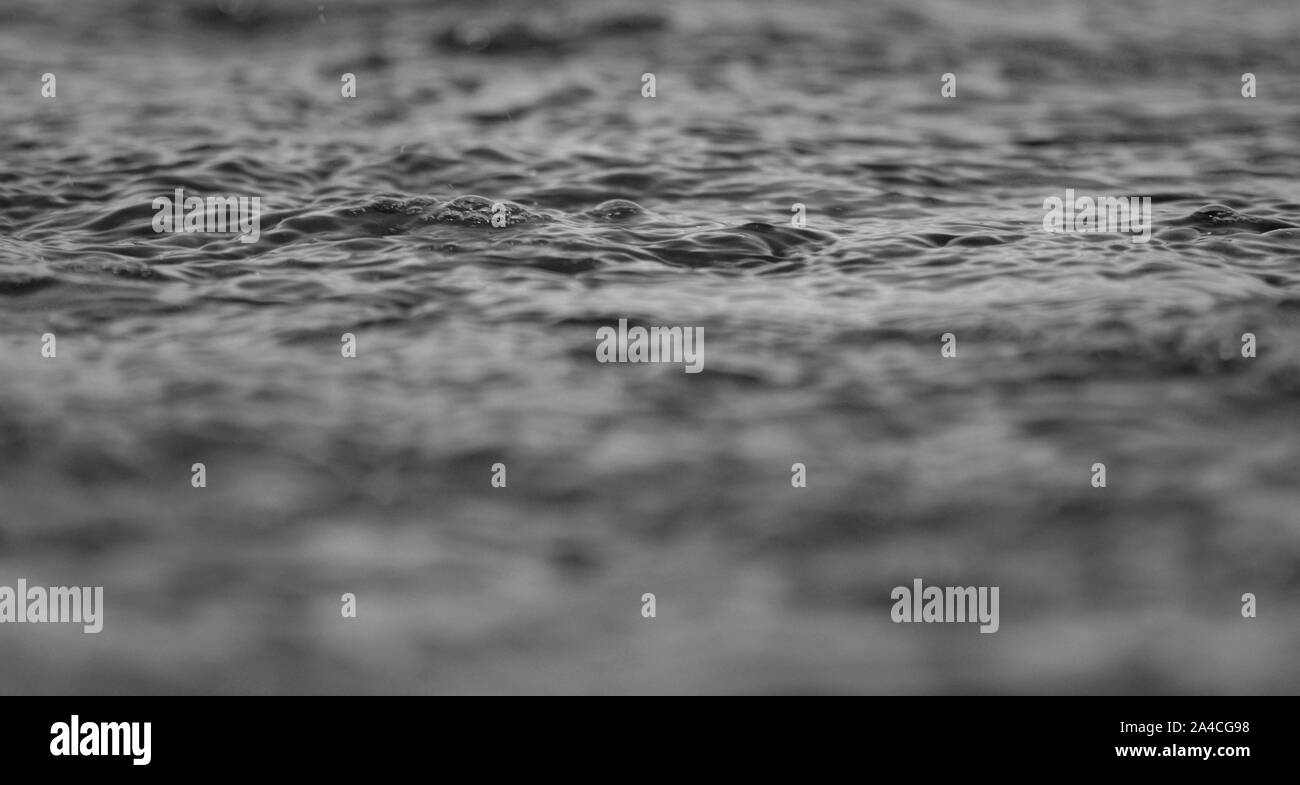 Night water ripple reflections. Black and White background. Dark tone ...