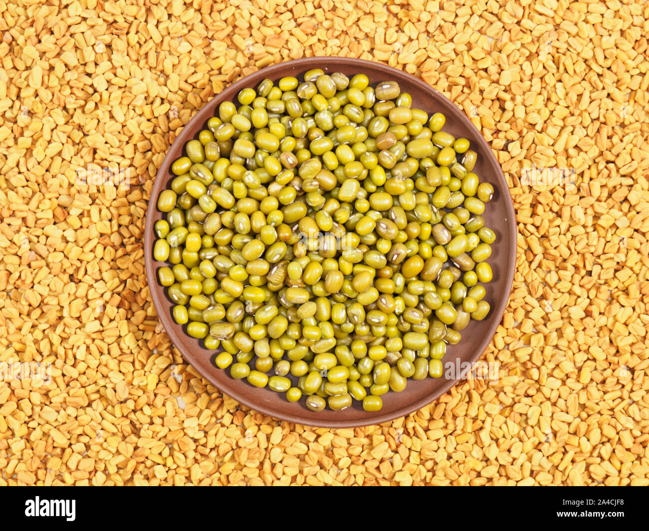 Green gram in clay plate. Background from Fenugreek. Indian cuisine ...