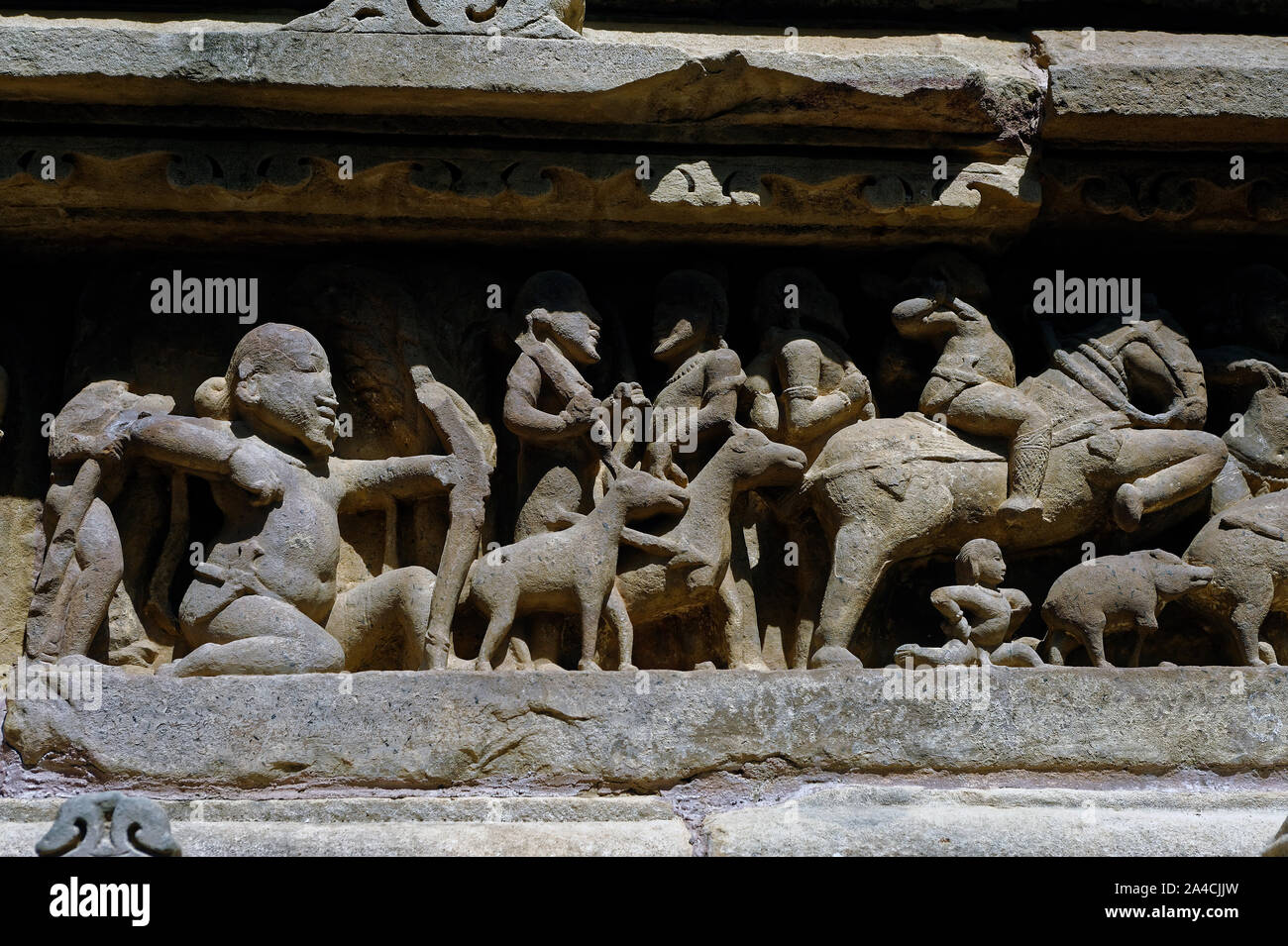 Carving of hunting scene Stock Photo - Alamy