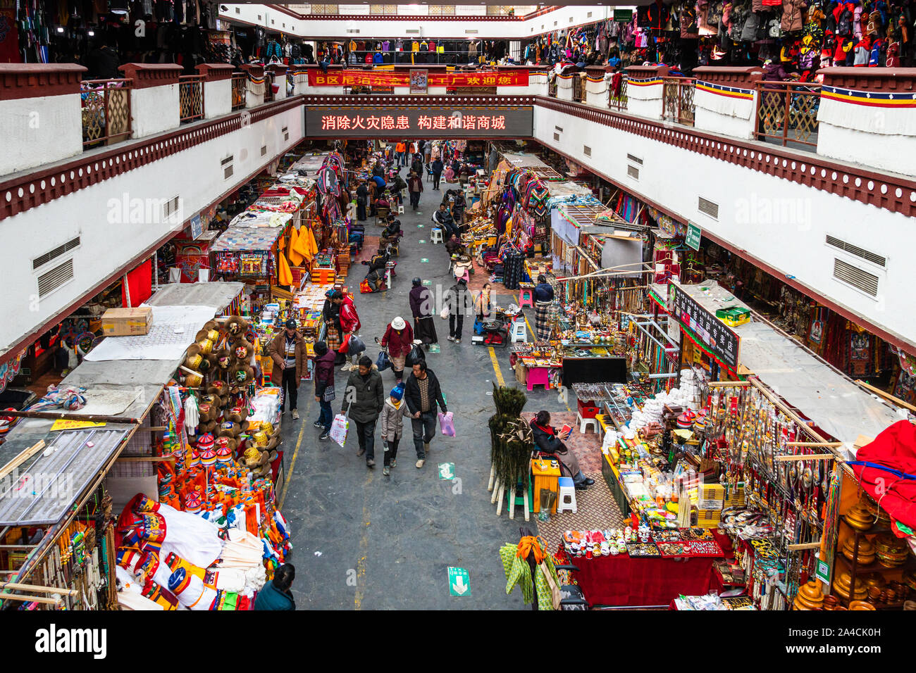 Lhasa, China - December 12 2018: People shop for traditional goods and ...