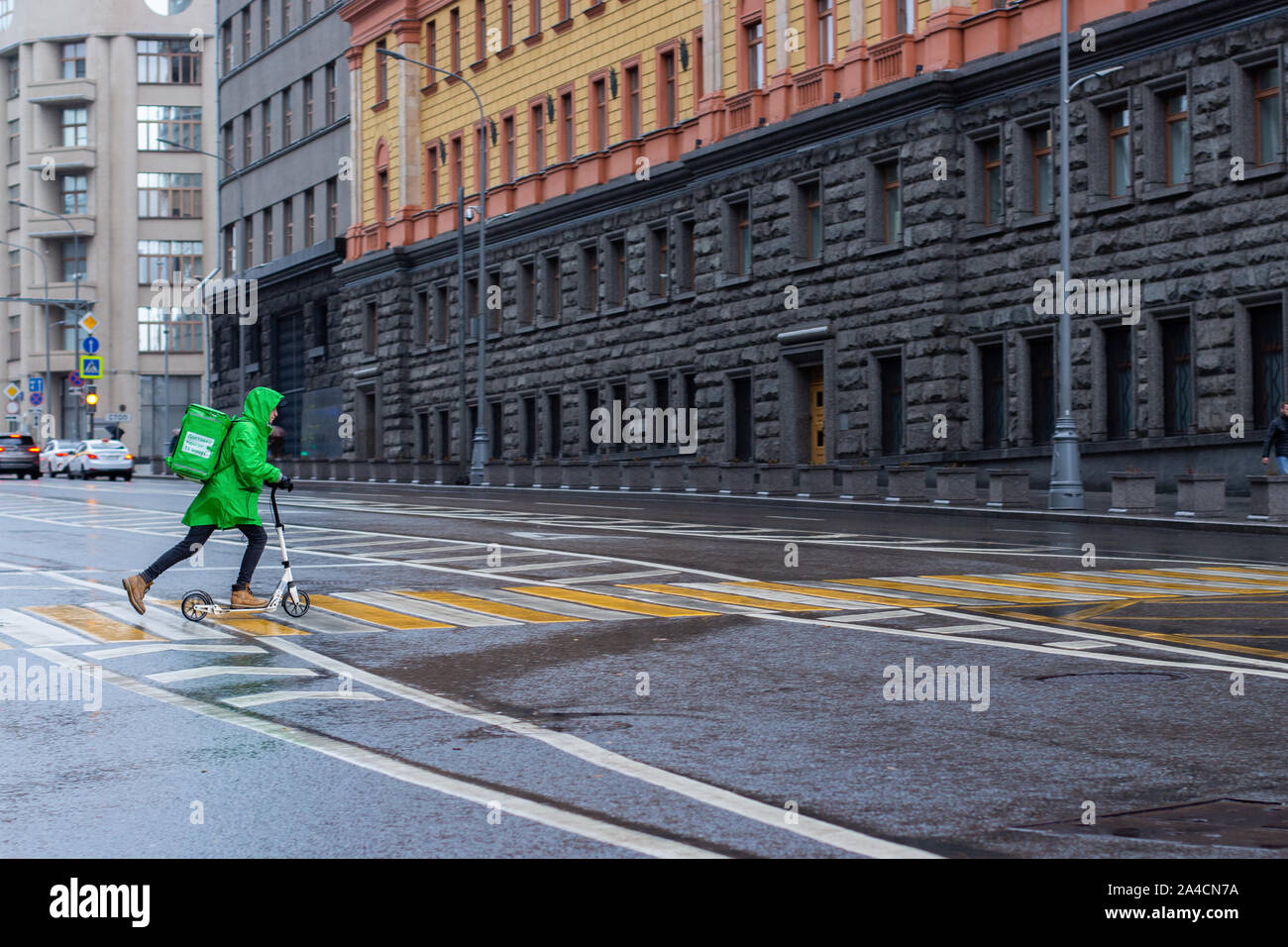 Delivery man green backpack rides hi-res stock photography and images ...