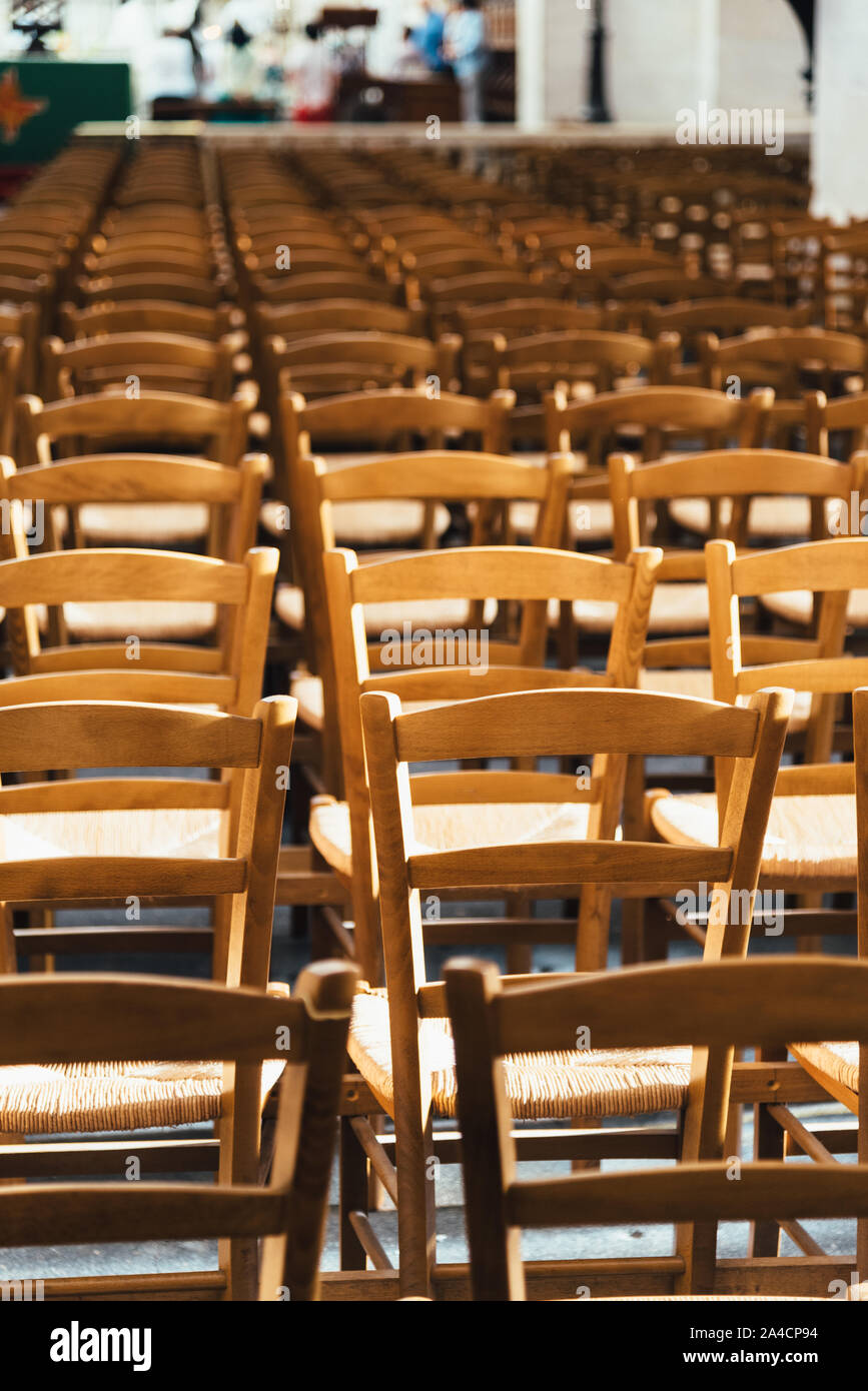 Empty chairs inside a church forming a pattern Stock Photo - Alamy