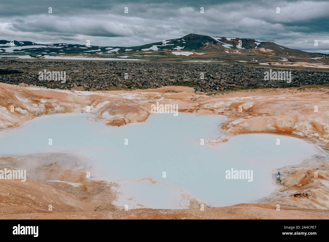 Leirhnjukur, Krafla fires in Iceland, blue water on clay hill, overcast ...
