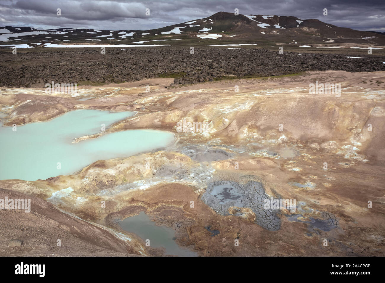 Leirhnjukur, Krafla fires in Iceland, blue water on clay hill, overcast ...