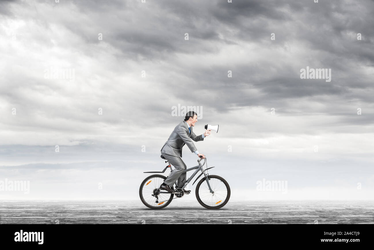 Man riding bike speech hi-res stock photography and images - Alamy