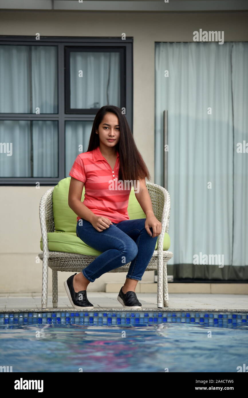 Pretty Teenage Female Sitting Stock Photo - Alamy