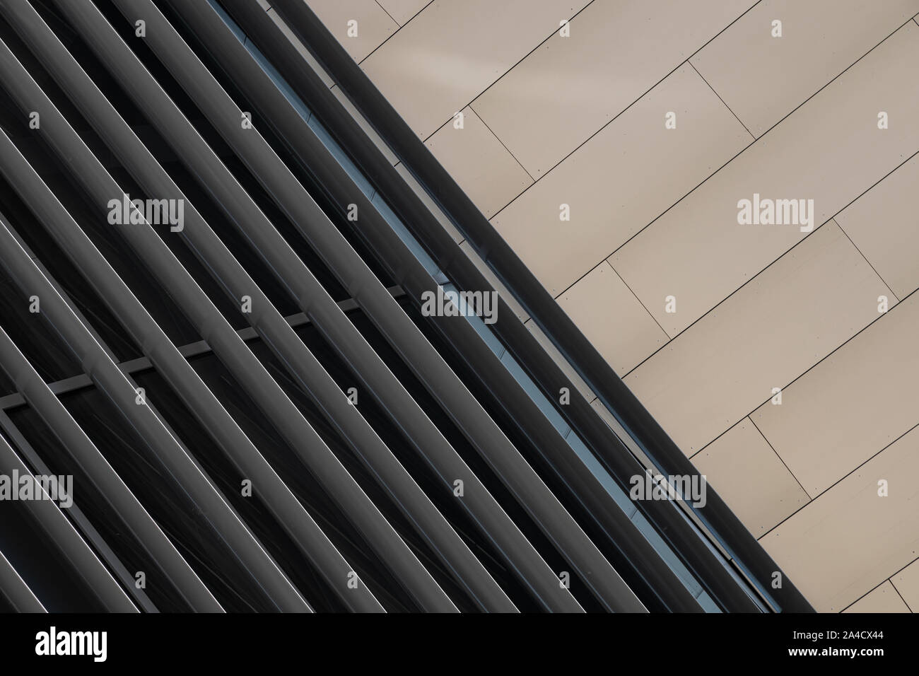 Angular view close-up of dark metal beams structure in part of building ...