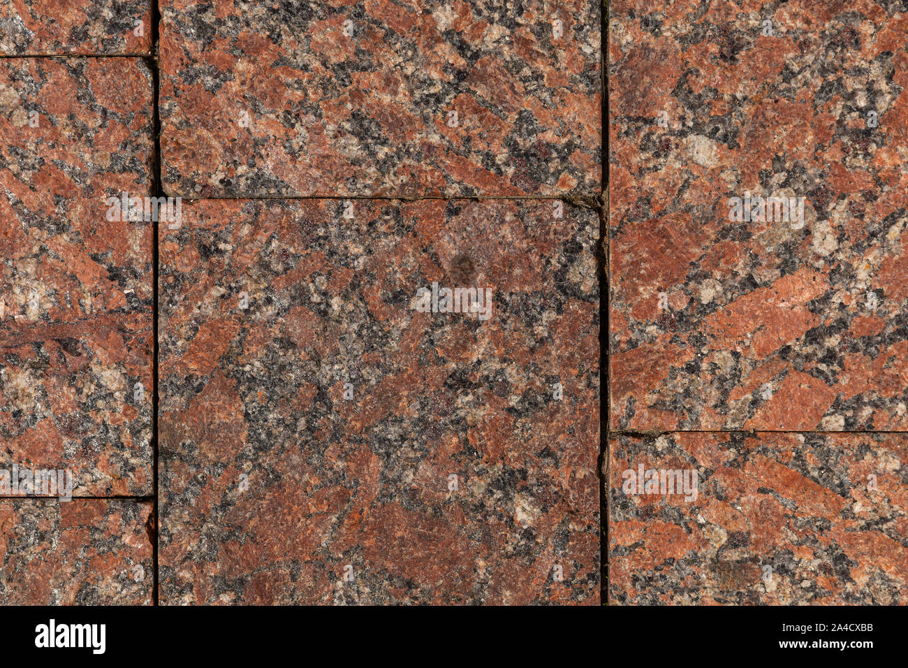Red marble textured background with blue spots. Brick tiles of stone ...