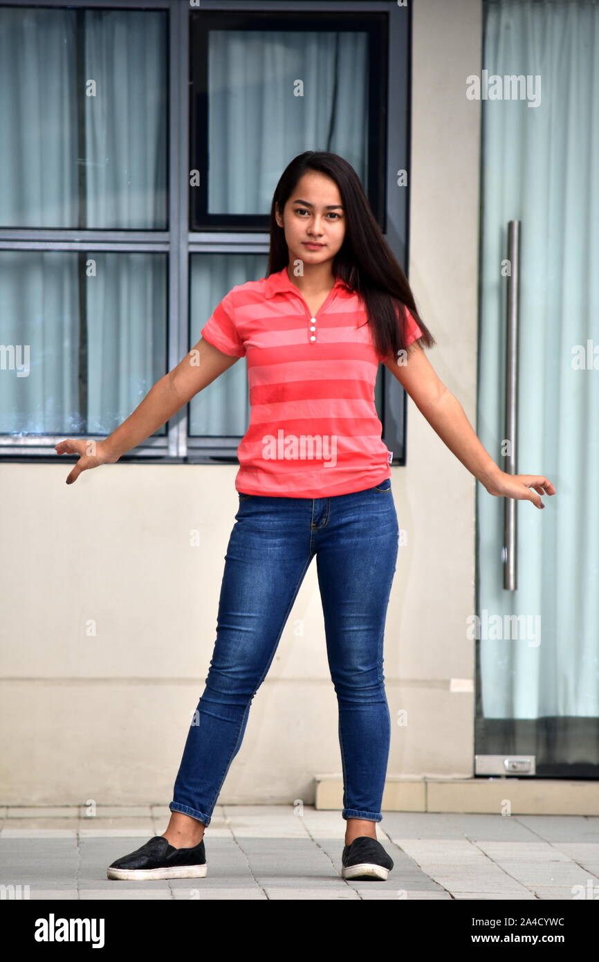 An Unemotional Asian Person Standing Stock Photo - Alamy