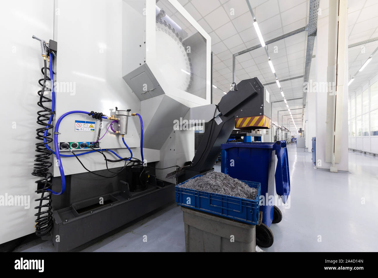 Inside of factory unit with new modern computerized equipment and box ...