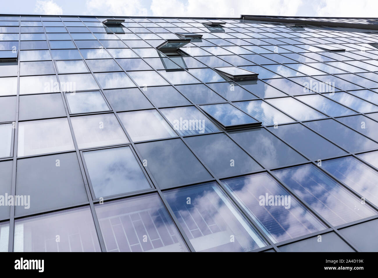 Reflection of sky on glass building facade Stock Photo - Alamy