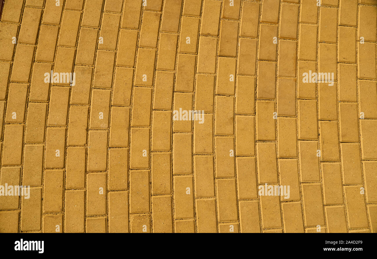 yellow paving tile for background or texture Stock Photo - Alamy
