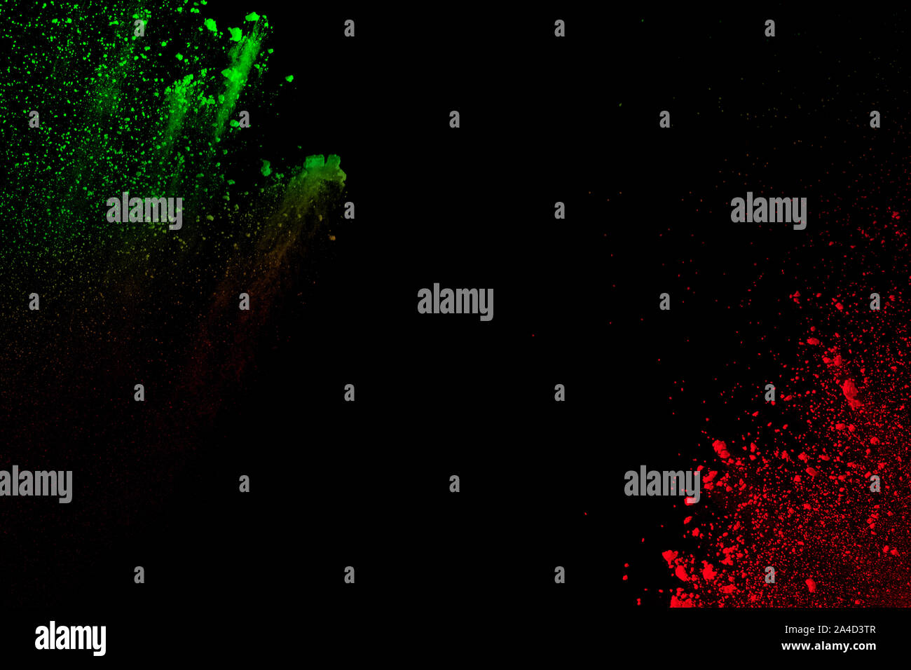 Red green powder explosion cloud on black background.Freeze motion of ...