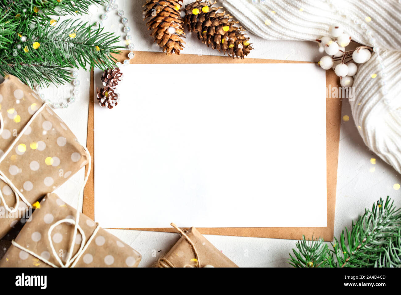 Merry Christmas and happy New year. Mockup with postcard and branches ...