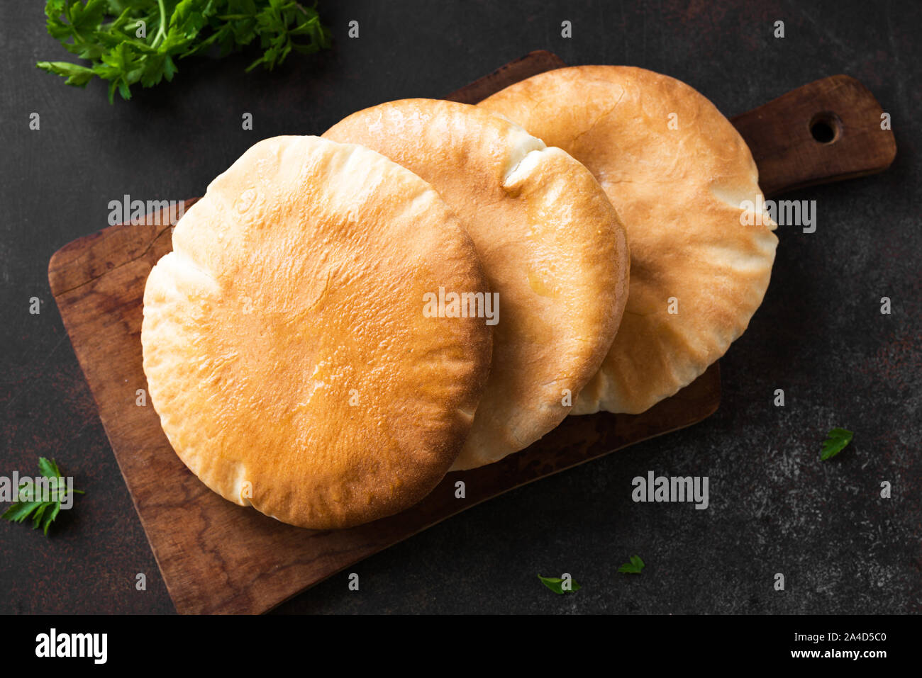 Arabic Pita Flat Bread on dark rustic background, top view, copy space ...