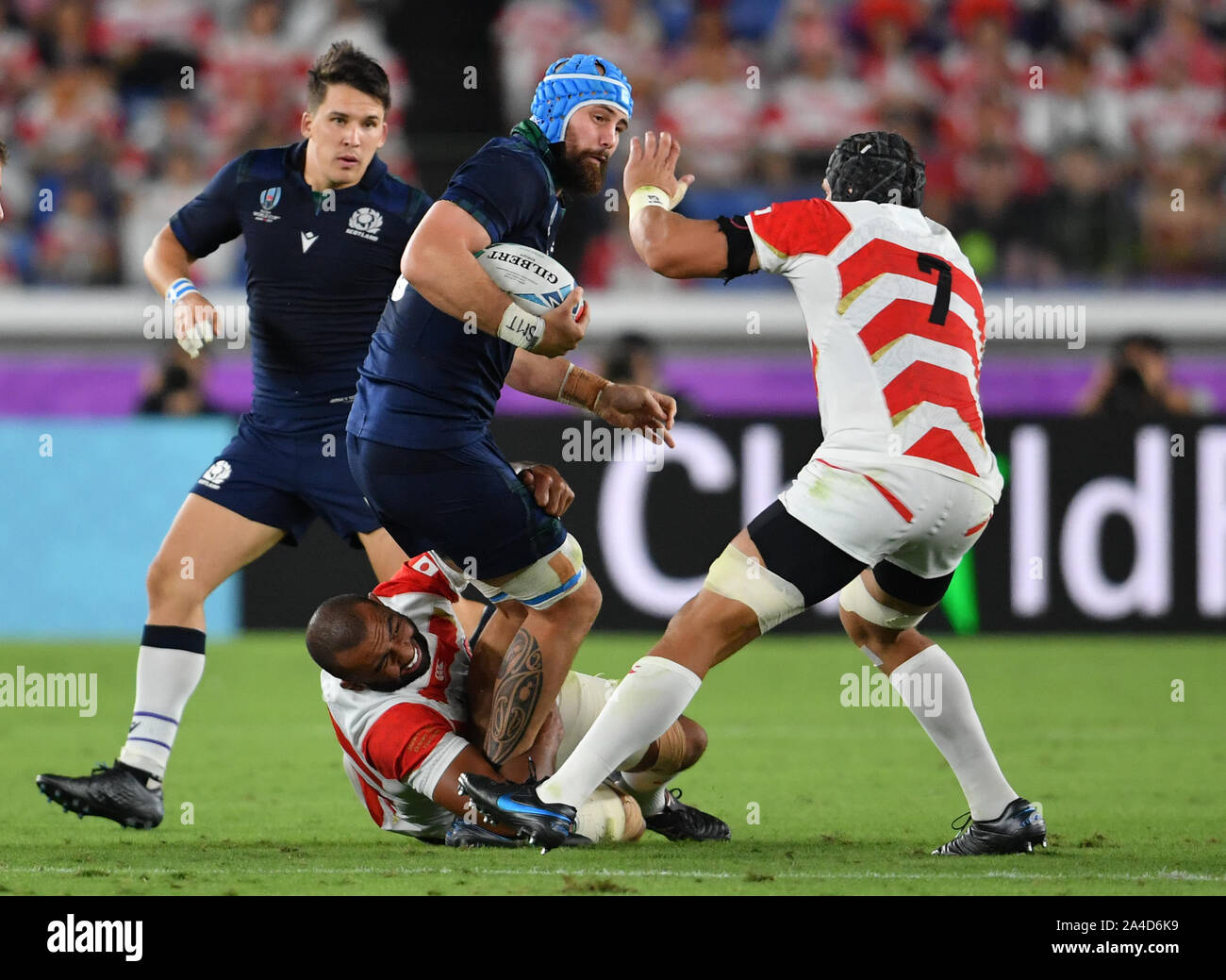 Scotland's Blade Thomson is tackled by Japan's Michael Leitch during ...