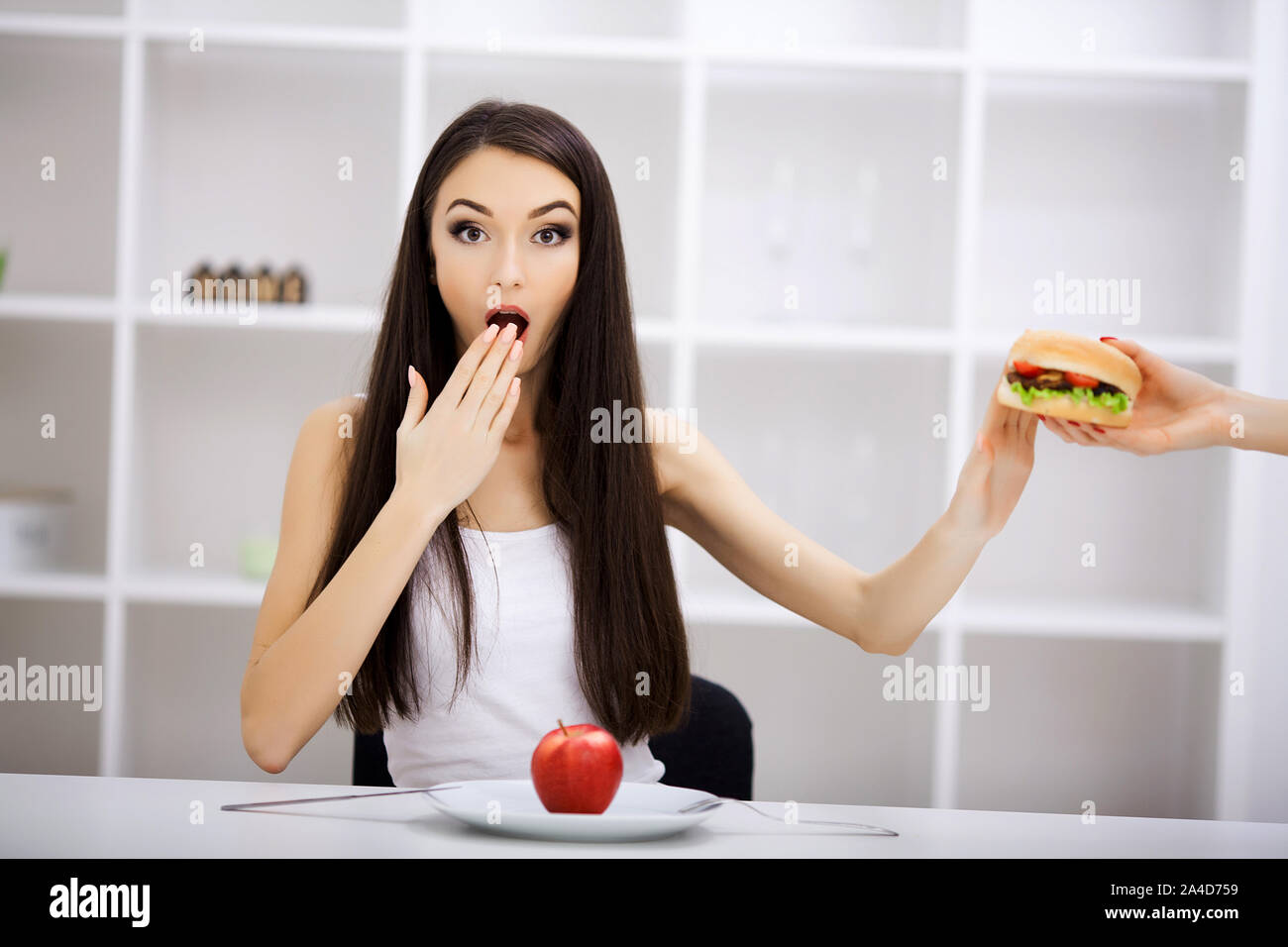 Choose between junk food versus healthy diet Stock Photo - Alamy