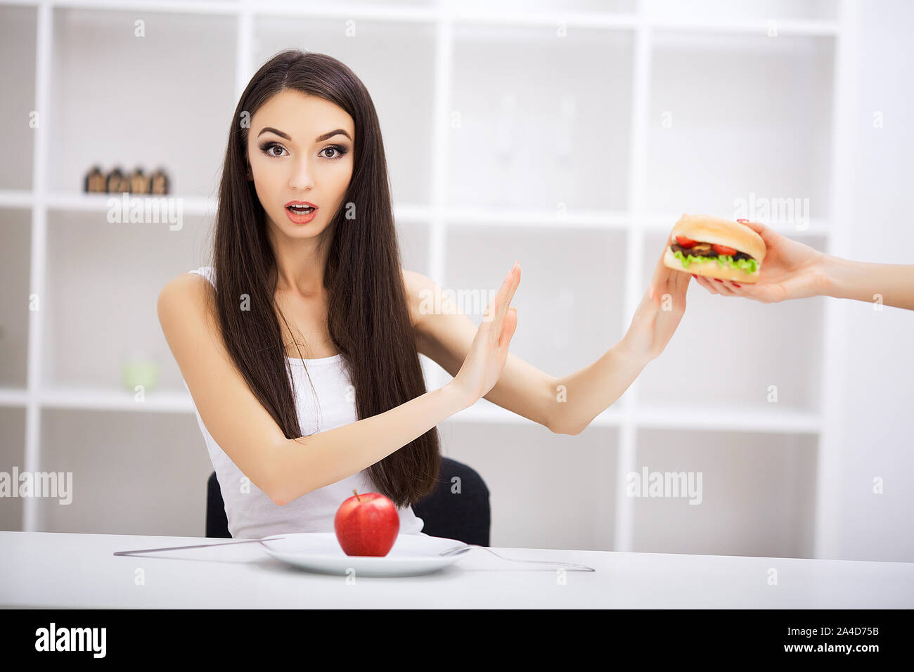 Choose between junk food versus healthy diet Stock Photo - Alamy