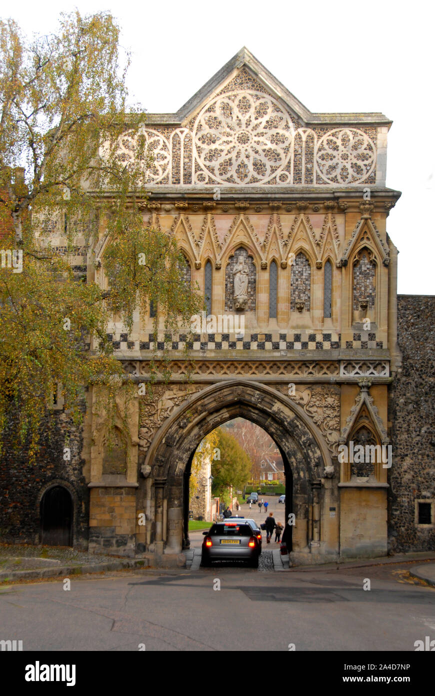 Modern car going through old narrow entrance gateway, Norwich, Norfolk ...