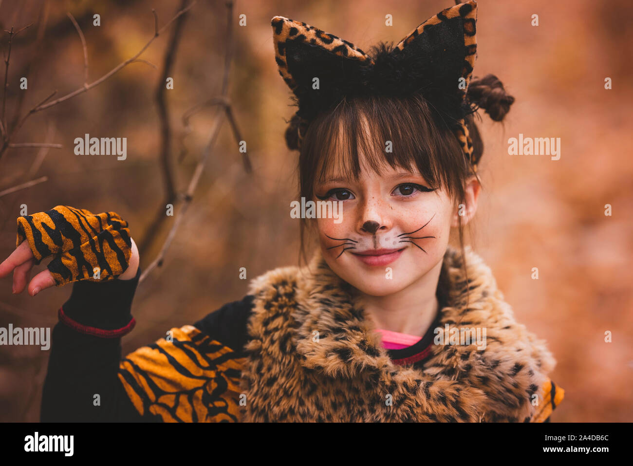 Girl in the forest dressed as a tiger for Halloween, United States ...